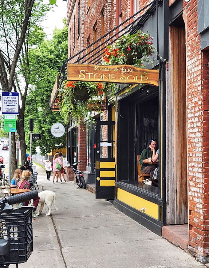 College Street's sidewalk offers prime people-watching opportunities for those lucky enough to snag a window seat on sunny afternoons.