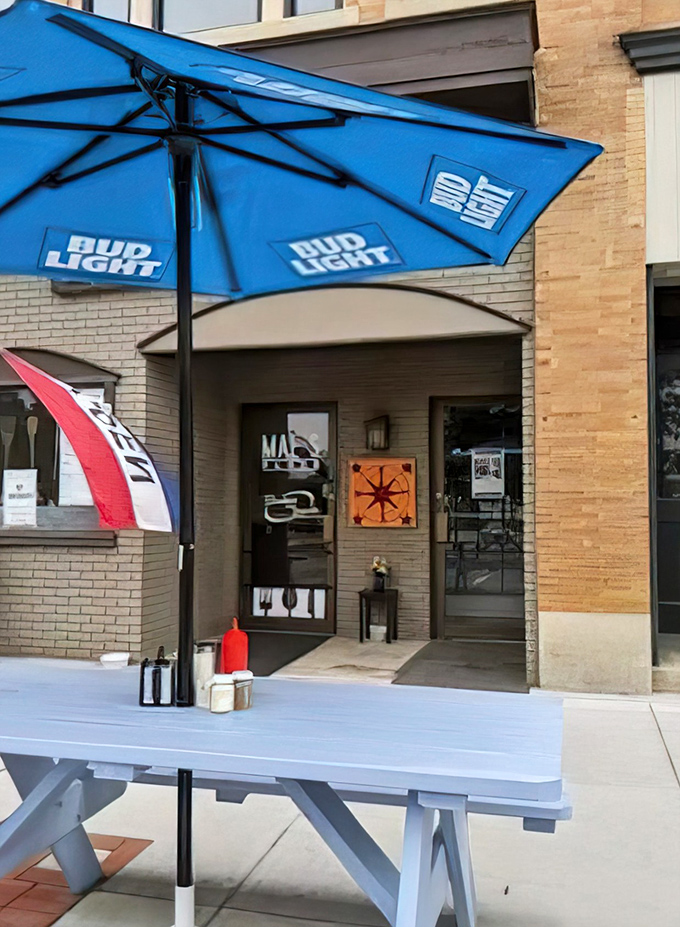Summer dining al fresco under the blue umbrella – where Vermont's fresh air somehow makes those home fries taste even better.