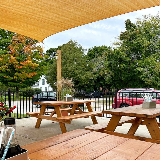 The outdoor seating area offers a perfect spot to enjoy Michigan's fleeting but glorious summer days while savoring exceptional food.