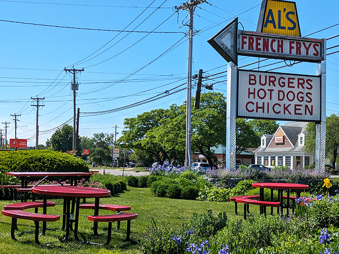 Outdoor picnic tables surrounded by flowers offer the perfect summer spot to enjoy Al's legendary offerings.