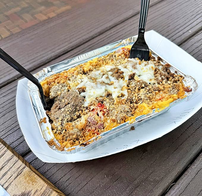 This isn't just mac and cheese &ndash; it's a cheesy masterpiece topped with Philly steak that might just change your life.