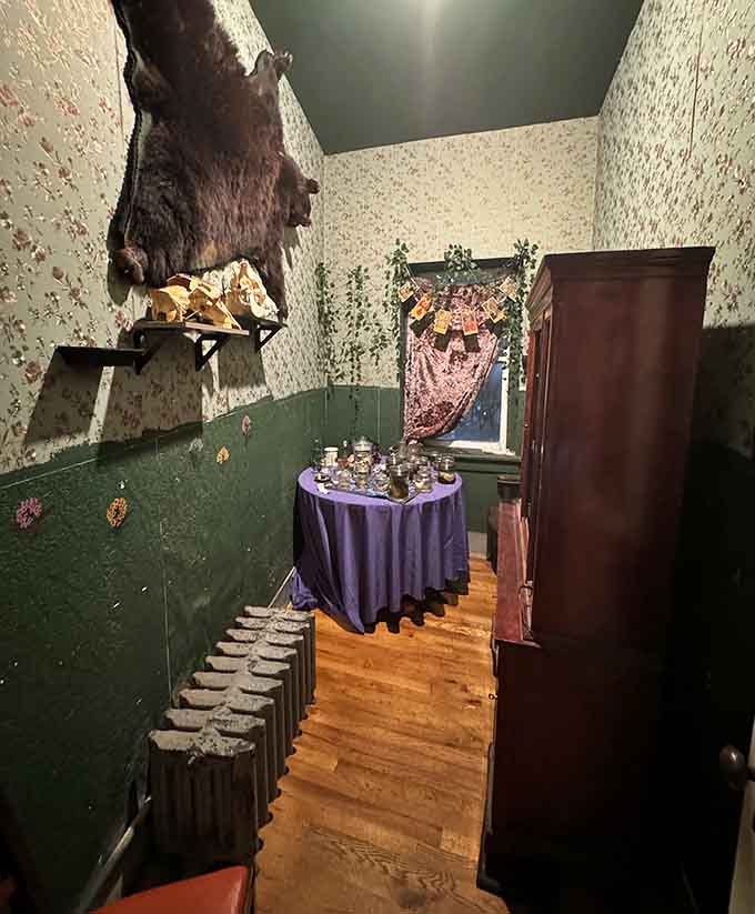 A Victorian-inspired room where the wallpaper alone could give you nightmares, and that's before you notice everything else.