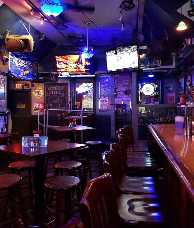 The seating area glows with that perfect amber bar lighting where everyone looks better and conversations flow more easily.