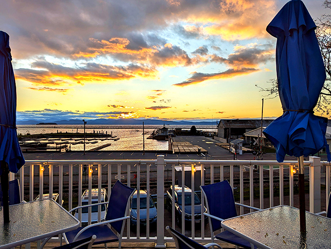 As the sun sets over Lake Champlain, the deck transforms into Burlington's most coveted dining spot, where nature provides the perfect closing act to a memorable meal.