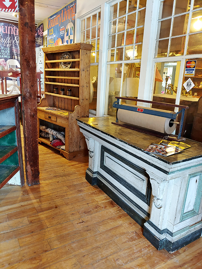 The shop's antique counter and wooden hutch aren't just display areas &ndash; they're authentic pieces that have served generations of shoppers.