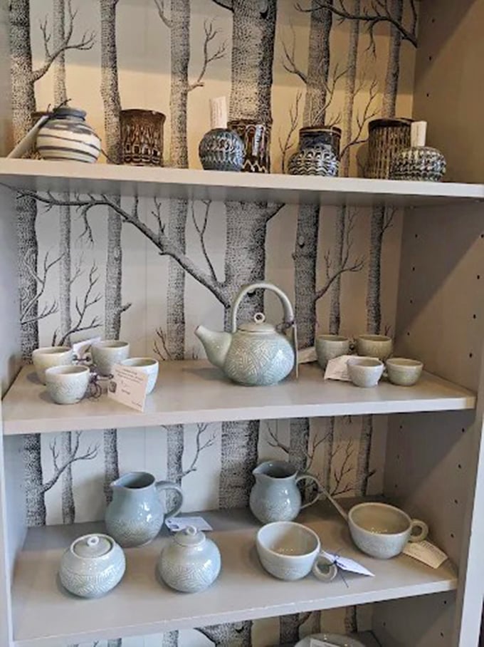 Pottery display against birch tree wallpaper &ndash; Vermont aesthetics that perfectly complement your coffee and scone experience.