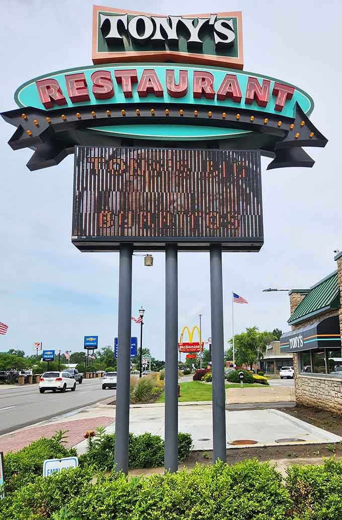 The sign promises "Eat Till It Hurts" which is both a warning and a challenge.