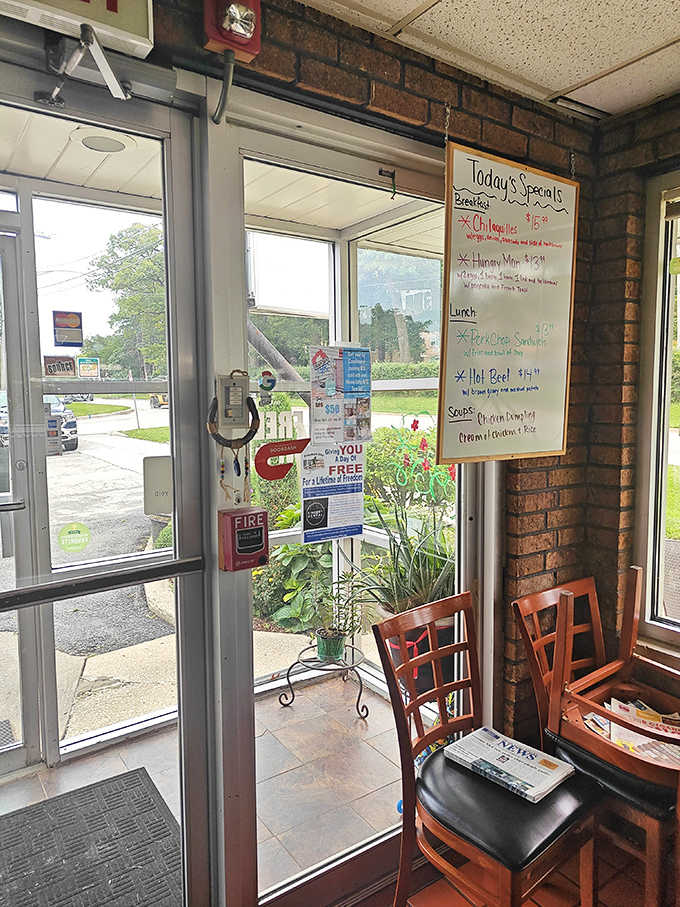The entrance welcomes guests with a glimpse of the day's specials and the promise of comfort food ahead.