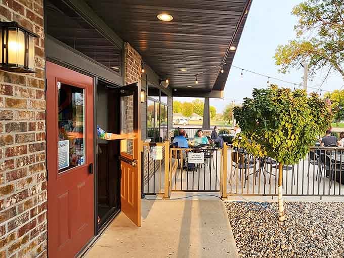 The welcoming patio with coral umbrellas beckons diners to enjoy Minnesota's precious warm weather alongside exceptional food. Photo credit: <a href="https://maps.google.com/maps/contrib/113539977712018864584" target="_blank" rel="noopener noreferrer">A.R.G. Company</a>	The welcoming patio with coral umbrellas beckons diners to enjoy Minnesota's precious warm weather alongside exceptional food.