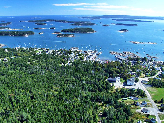From above, Stonington reveals its perfect positioning &ndash; a village nestled between forest and sea, surrounded by a constellation of islands.