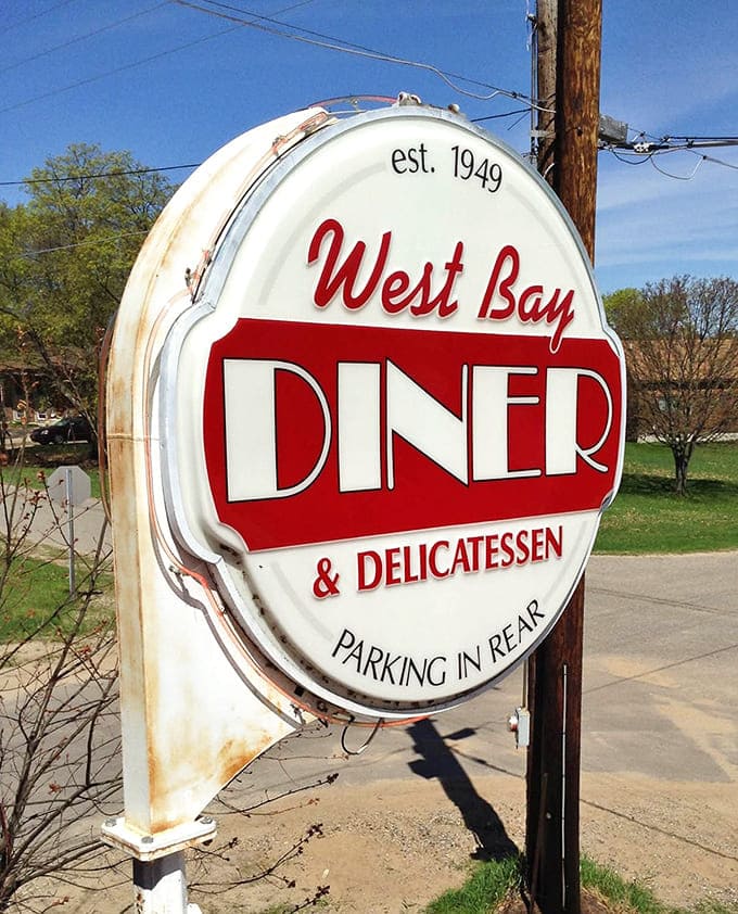 That vintage sign established in 1949 stands as proof that some places just get better with age, like fine wine but tastier.