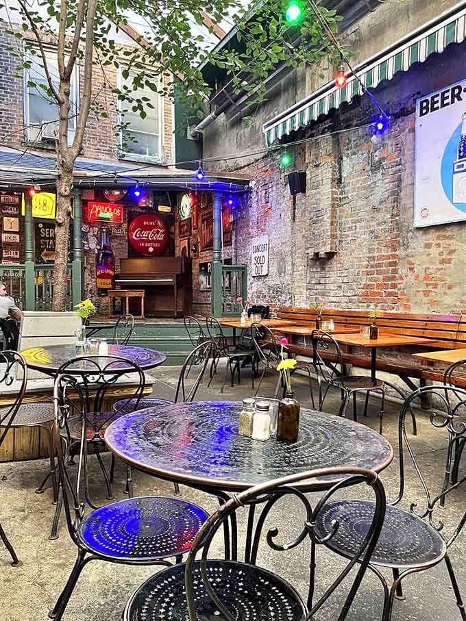 The hidden courtyard feels like stumbling upon a secret garden &ndash; string lights twinkle above metal tables where conversations flow into the night.