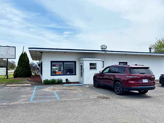 Unassuming entrance, extraordinary experience – this modest parking area leads to one of Tawas City's most beloved breakfast destinations.