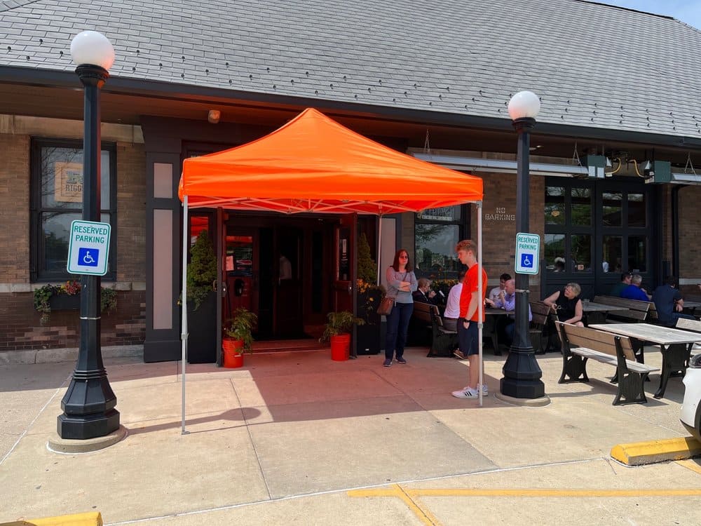 The entrance to Black Dog welcomes guests with the promise of barbecue excellence and those famous fries that have achieved cult status.