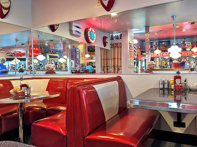Red and silver booths reflect decades of family gatherings, first dates, and comfort food celebrations. If these seats could talk...