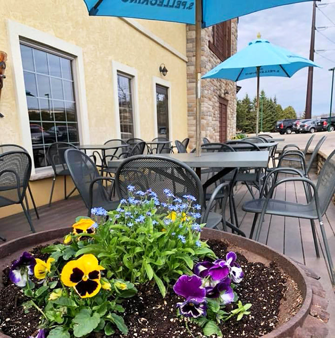 Outdoor seating with umbrellas and fresh flowers provides the perfect spot to enjoy your meal when Minnesota weather cooperates nicely.