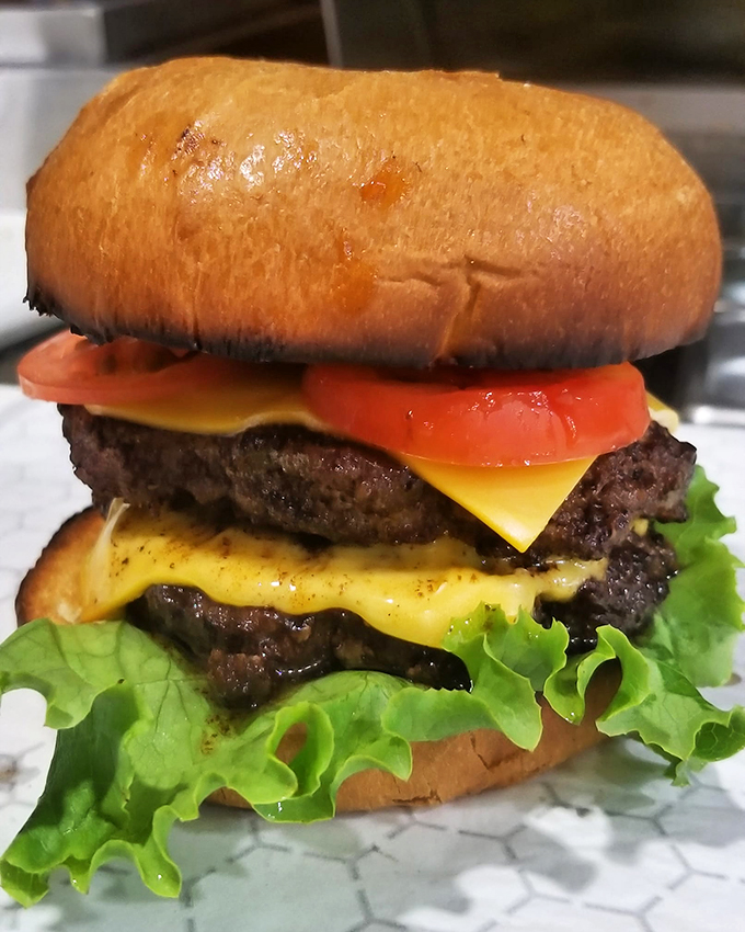 Plot twist: The donut shop serves killer burgers! This juicy masterpiece shows that A'More Donuts isn't afraid to think outside the pastry box.