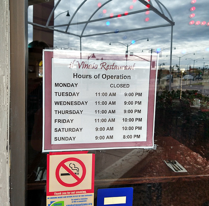 Business hours posted clearly – because knowing when you can get your next burger fix is essential information for locals.