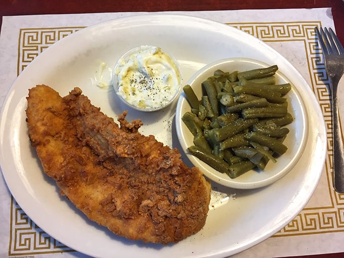 Southern comfort on a plate: crispy catfish and vibrant green beans. It's a taste of the South, Ohio-style.