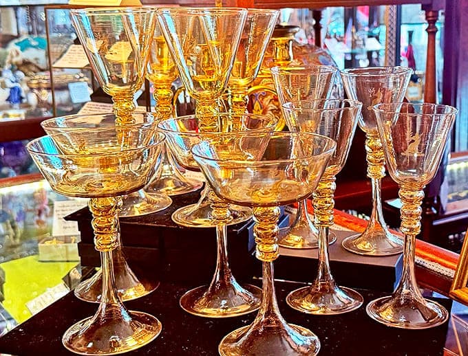 Amber stemware catches the light like liquid gold &ndash; imagine the champagne toasts and whispered secrets these glasses have witnessed through the decades.