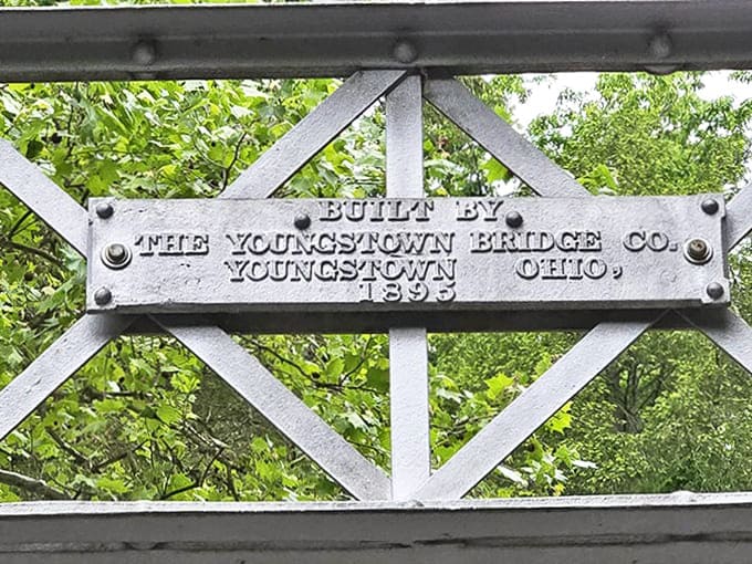 This original plaque from 1895 tells the bridge's origin story, connecting today's visitors with the craftsmen who created this enduring treasure.