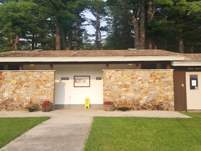 Modern amenities meet rustic charm in this stone-faced comfort station, proving even practical buildings can be pretty.