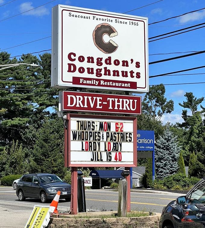 This roadside sign has been guiding hungry travelers to doughnut paradise for decades, a beacon of fried hope.