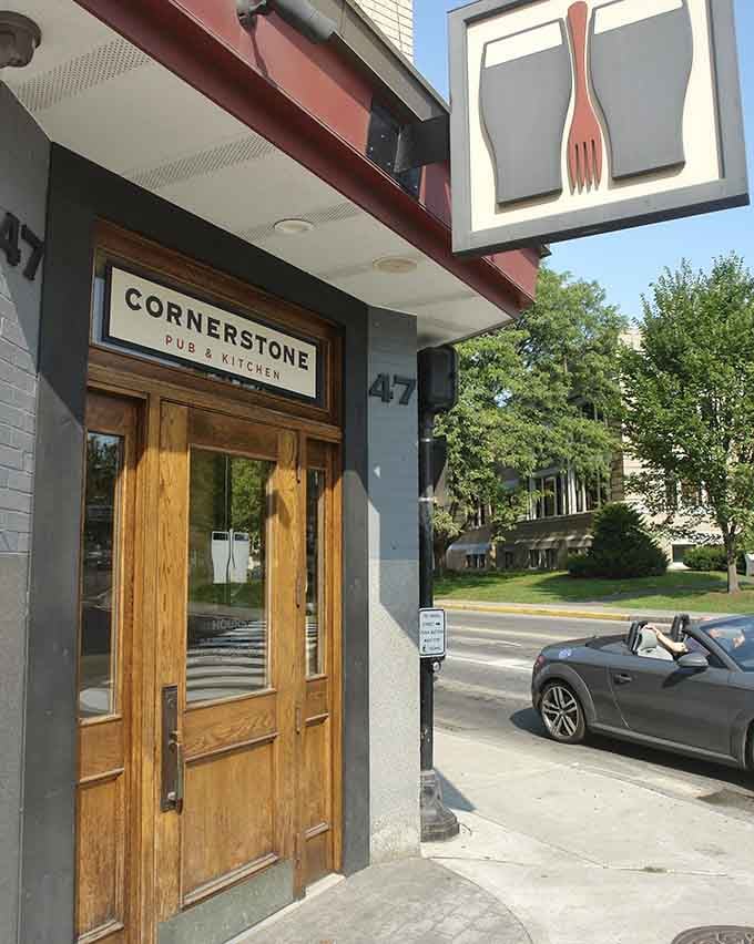 The welcoming entrance with its wooden door and modern signage sets the tone for the quality experience waiting inside.