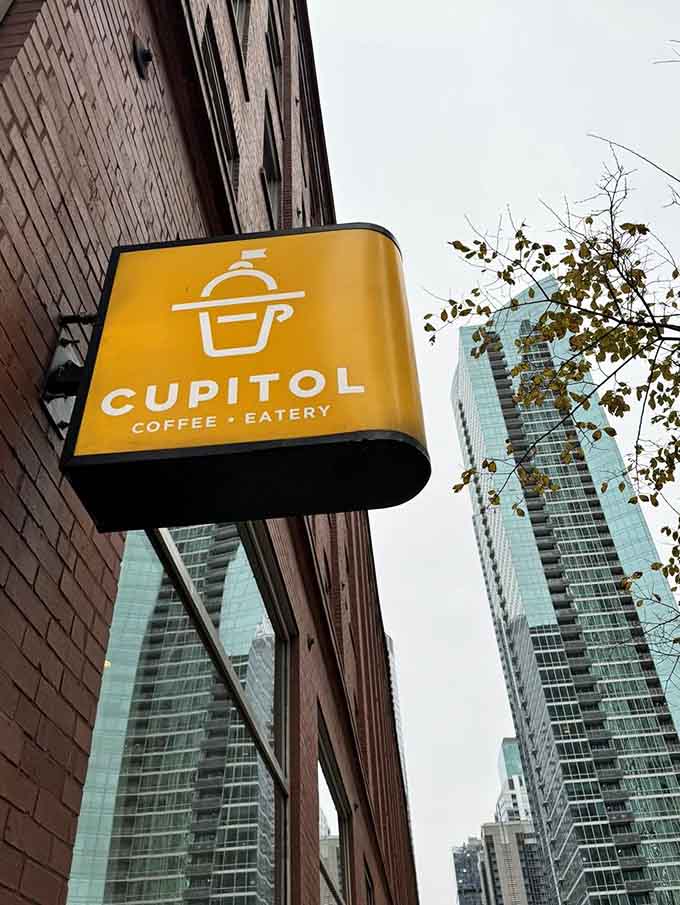 The Cupitol sign stands proud against the Chicago skyline, marking the spot where breakfast dreams come true and croissants reign supreme over all other bread products.