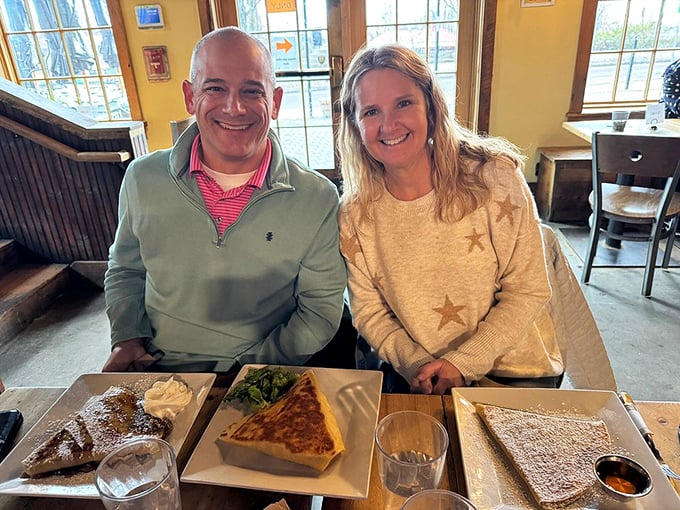 Happy diners surrounded by a feast of crepes &ndash; their smiles tell you everything you need to know about what awaits inside The Skinny Pancake.