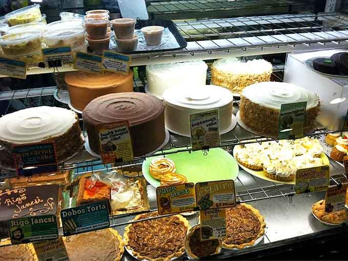 The dessert case at Zingerman's proves that their commitment to excellence extends beyond sandwiches to sweets that make grown adults contemplate licking the plate.