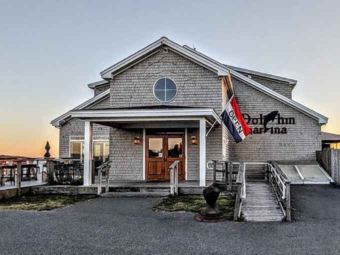 The view that launched a thousand return visits: Dolphin Marina at golden hour, looking exactly like a postcard come to life.