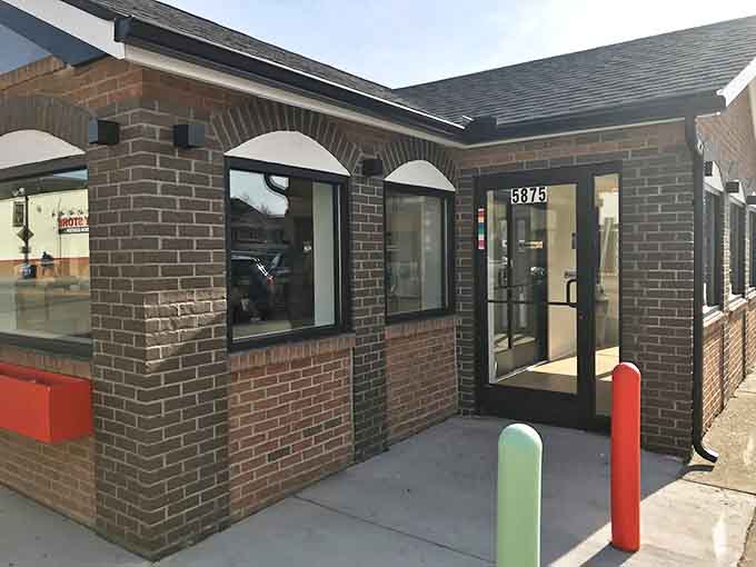 The welcoming front entrance with its cheerful colored accents practically begs you to come inside and discover what all the fuss is about.