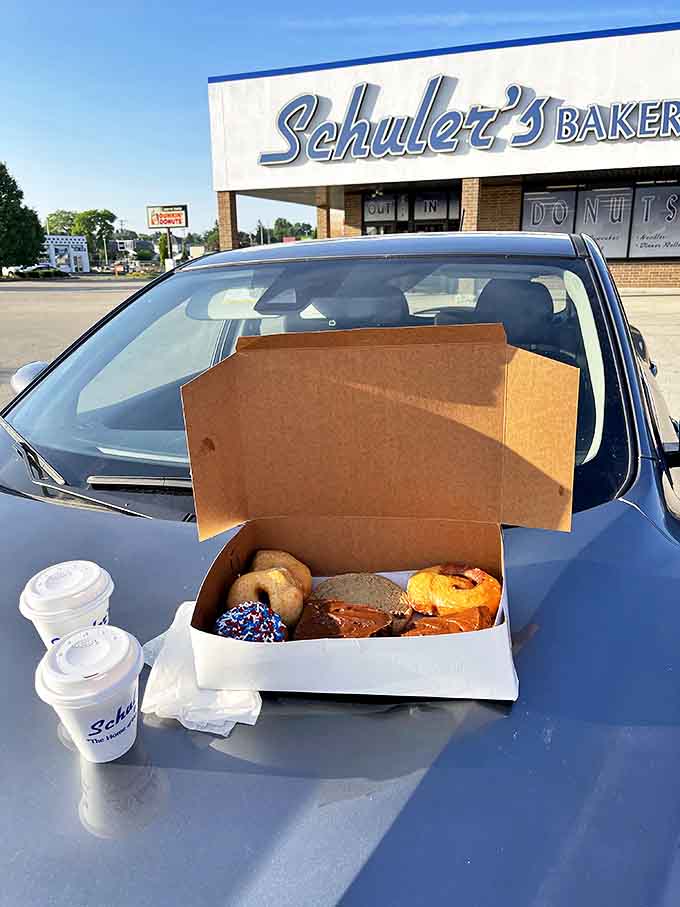 The ultimate Schuler's experience: donuts and coffee in the car, because waiting until you get home requires superhuman willpower.