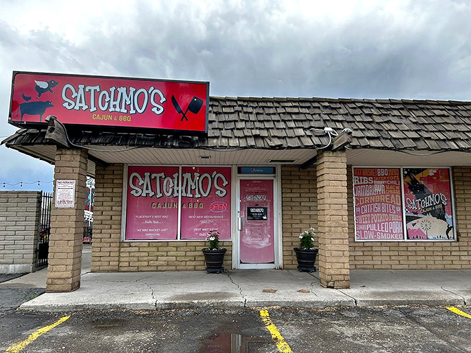The entrance to flavor town! Satchmo's pink-accented facade is like a beacon for hungry travelers seeking authentic Cajun flavors in the Southwest.