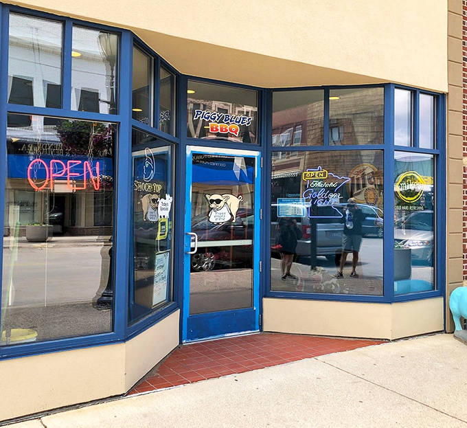 The entrance beckons with promises of smoky delights &ndash; blue-framed windows offering a glimpse into barbecue paradise.