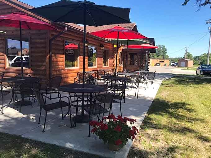 Outdoor seating with bright umbrellas creates an inviting space to enjoy your meal surrounded by fresh air and natural beauty.