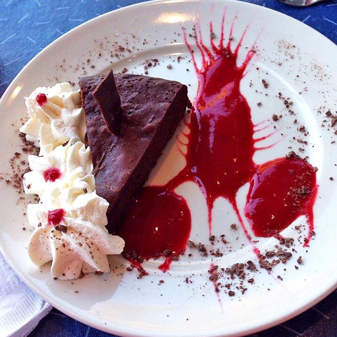 Chocoholics, unite! This flourless wonder is denser than a murder mystery and smoother than a jazz saxophone. Resistance is futile!