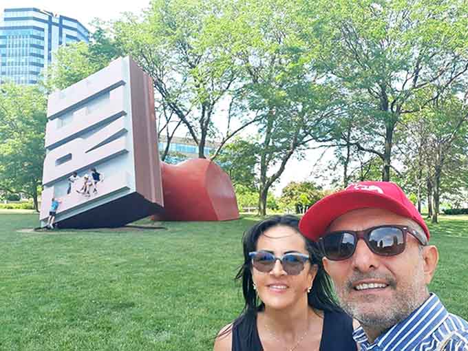 Tourists capture a memory with Cleveland's quirkiest landmark, proving that sometimes the best souvenirs are the unexpected discoveries along the way.