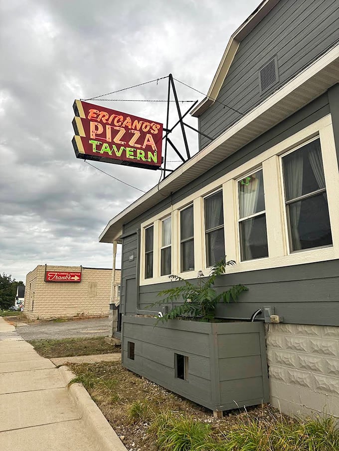 That vintage sign beckons like a beacon of deliciousness, promising thin-crust pizza that's earned its worldwide reputation one slice at a time.