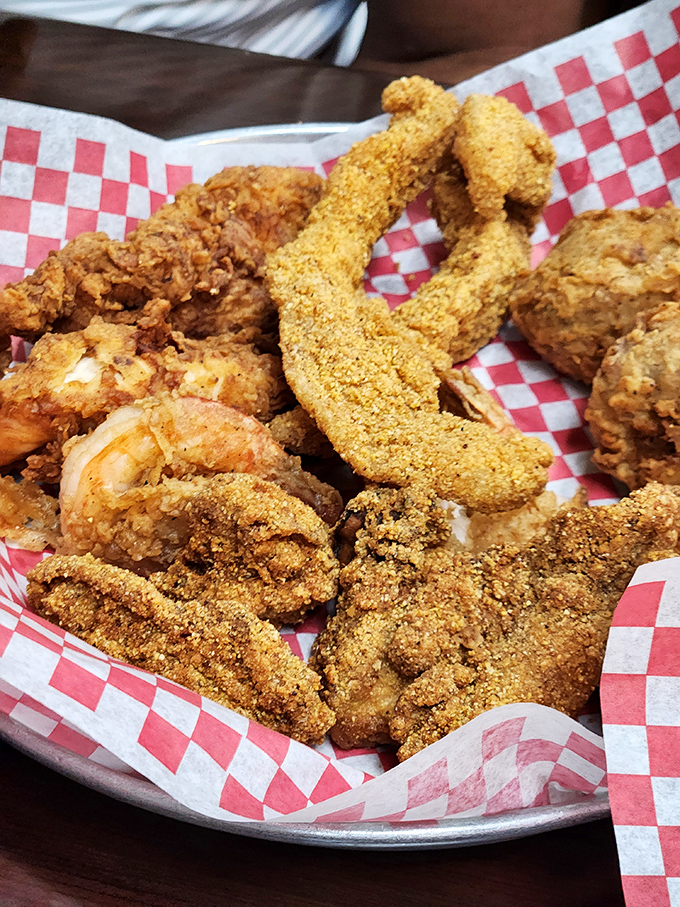 A platter of perfectly fried seafood that proves the kitchen has mastered the art of the crispy coating while keeping the protein tender and moist.