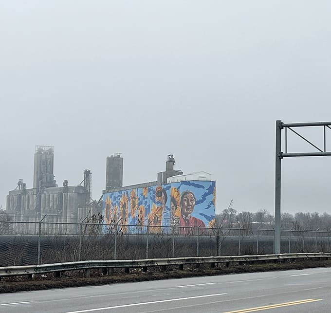 Highway drivers get a preview of Toledo's artistic ambitions, with the mural visible from the road like a colorful billboard for the city itself.