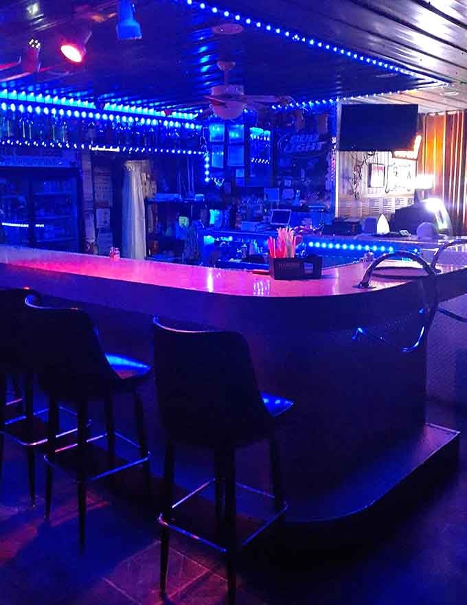 The bar glows blue like a beacon, calling thirsty patrons to belly up properly.