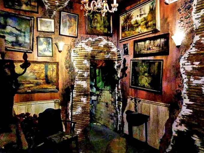 Vintage paintings create an unsettling gallery effect in this corridor, where the walls themselves seem to watch your every move.