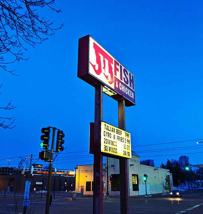 That sign glowing against the evening sky is like a lighthouse for anyone craving catfish nuggets, guiding them home to crispy, golden satisfaction.