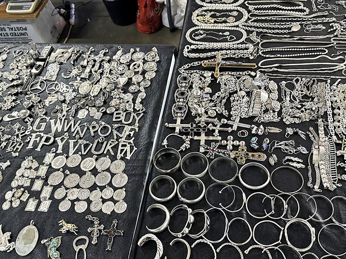 Silver jewelry gleams under market lights – each piece waiting to become someone's favorite accessory or treasured gift.