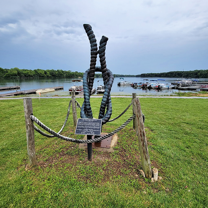 The sculpture takes on different personalities throughout the day, here commanding attention against gathering storm clouds.
