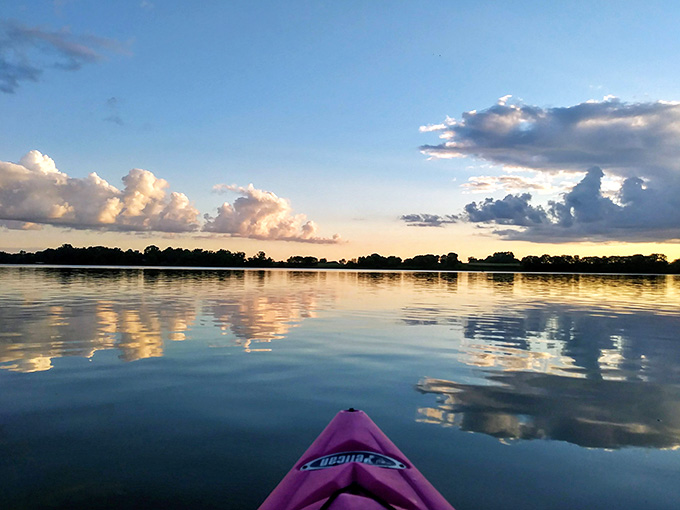 Kayaking into a sunset this spectacular should probably be illegal, or at least require some kind of permit for experiencing too much beauty at once.