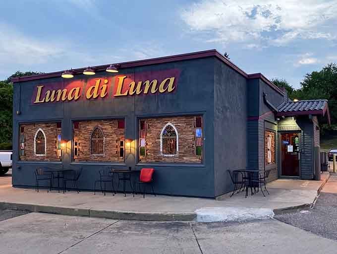 The exterior at dusk looks inviting and warm, beckoning hungry travelers to discover the Chicken Parmigiana that's about to change their Italian food standards forever.