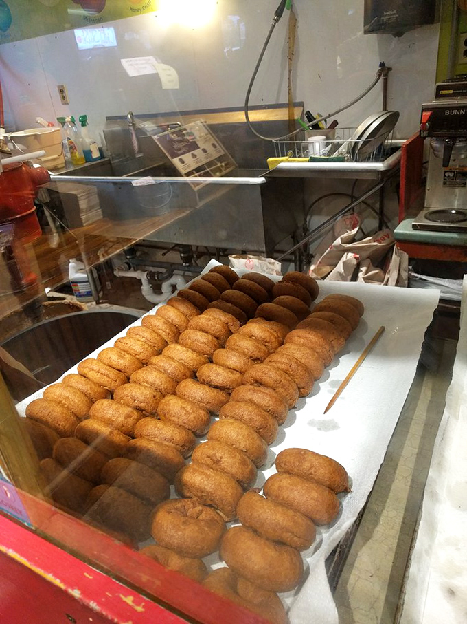 Donut perfection in progress &ndash; rows of fresh cider donuts cooling before they're devoured by eager visitors from around the world.